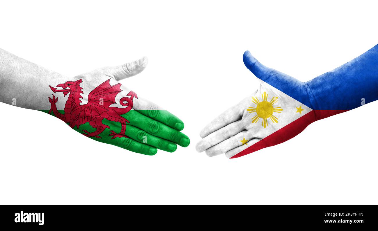Handshake between Philippines and Wales flags painted on hands ...