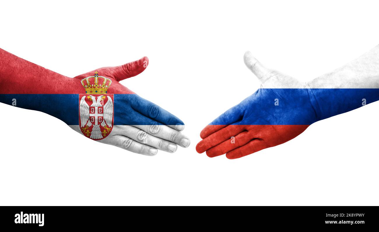 Handshake between Russia and Serbia flags painted on hands, isolated ...