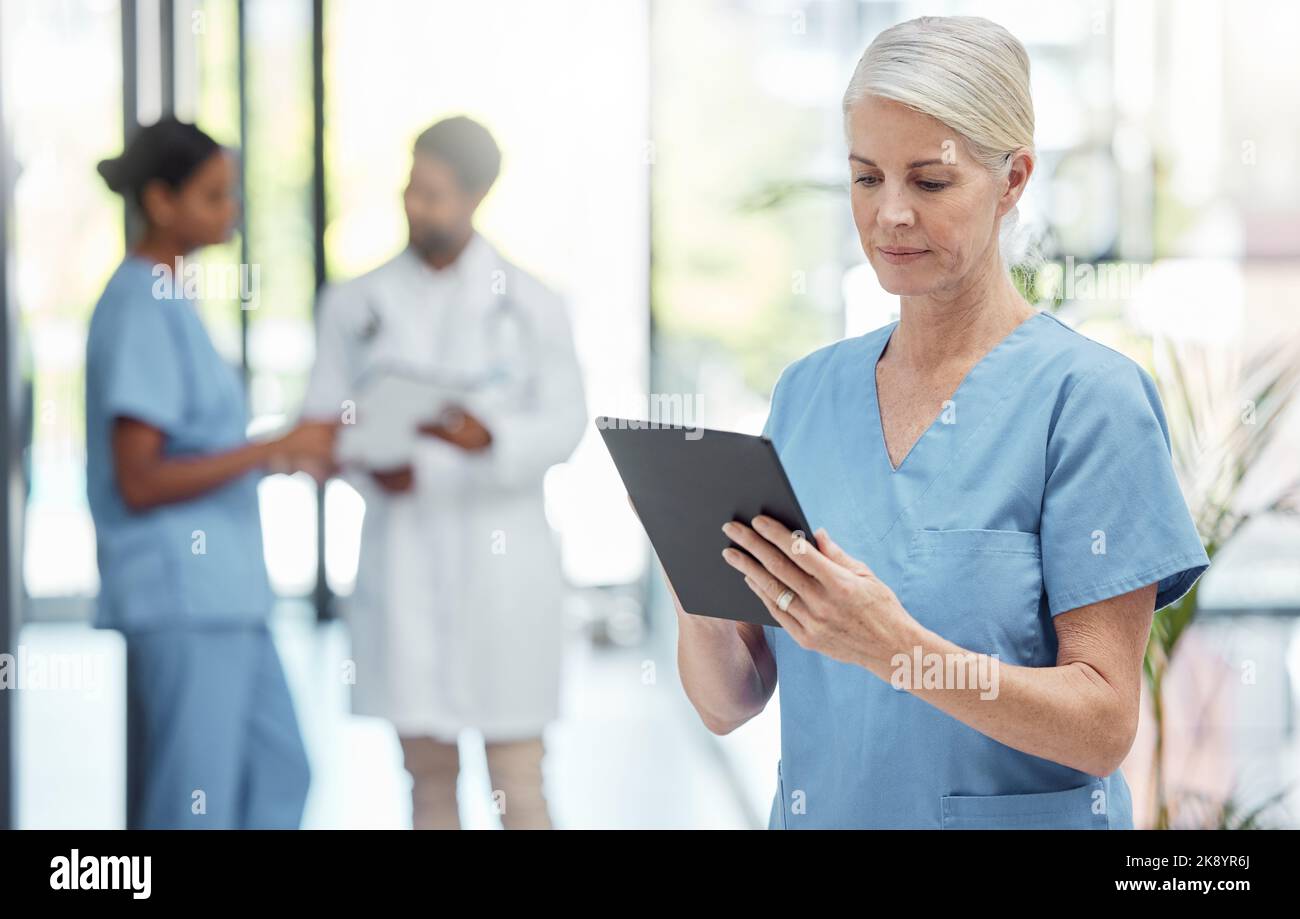 Nurse, tablet and hospital, health and woman check patient information ...