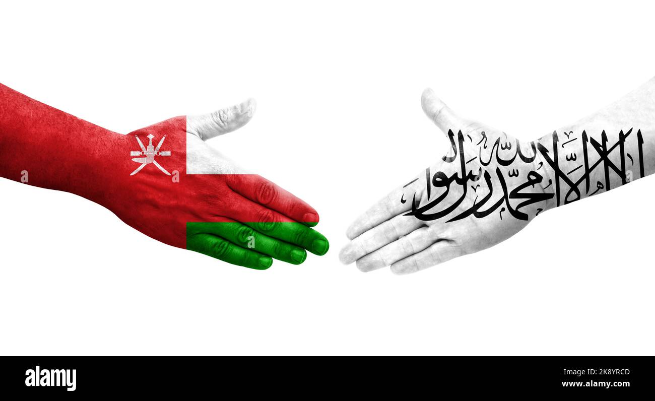 Handshake between Saint Vincent Grenadines and Oman flags painted on ...