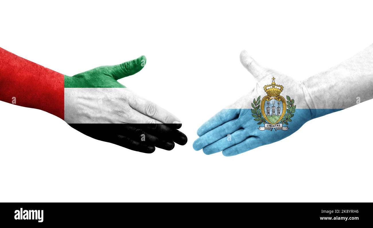 Handshake between San Marino and UAE flags painted on hands, isolated ...