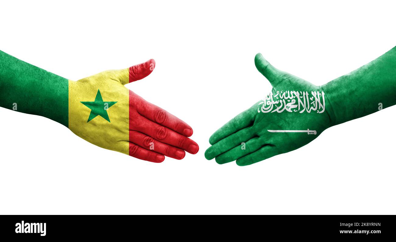 Handshake between Saudi Arabia and Senegal flags painted on hands ...