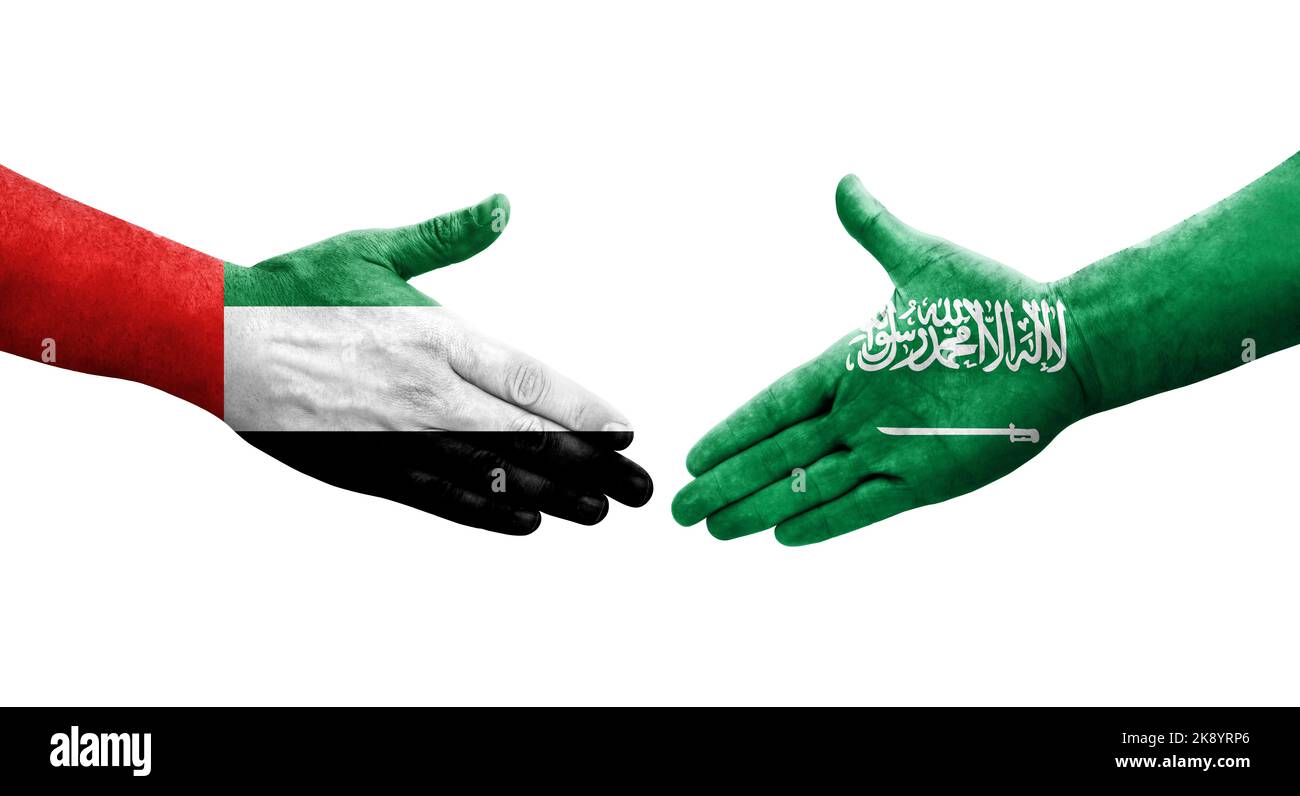 Handshake between Saudi Arabia and UAE flags painted on hands, isolated ...