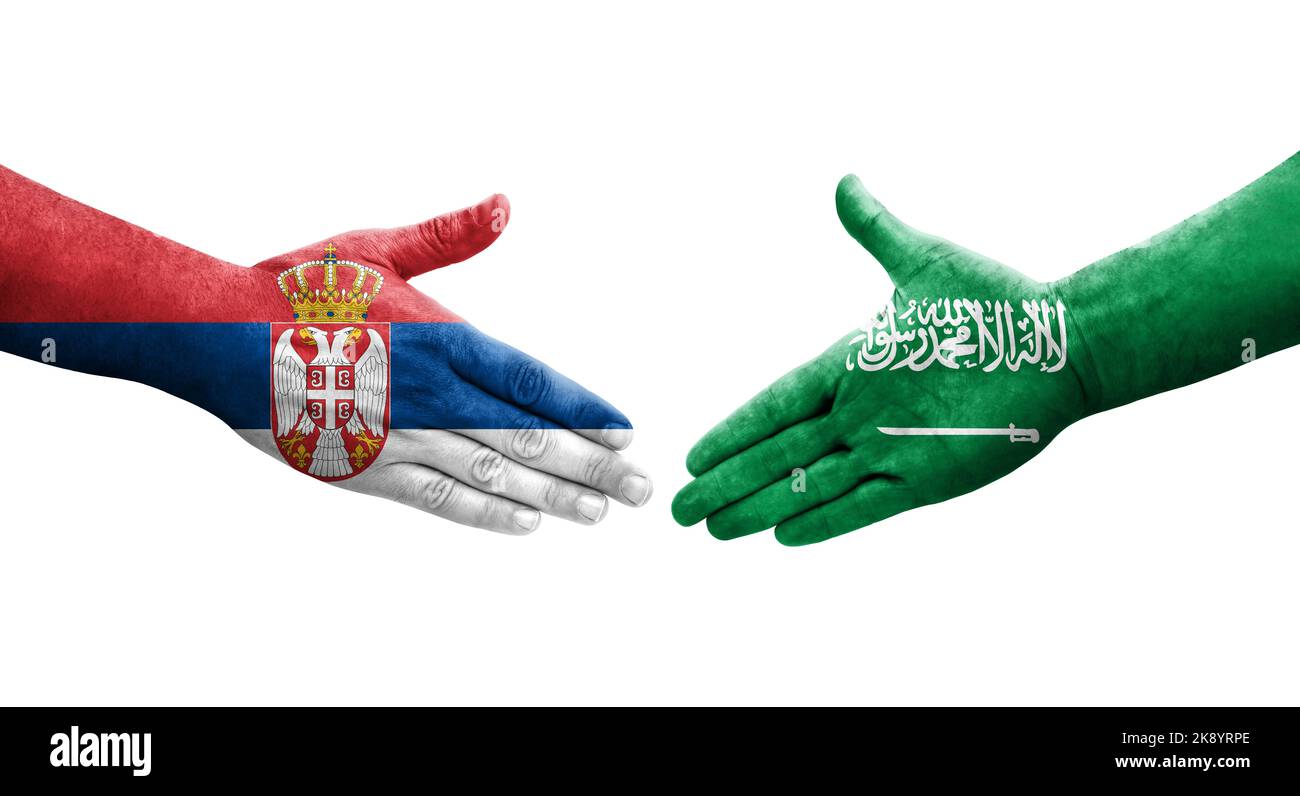 Handshake between Saudi Arabia and Serbia flags painted on hands ...