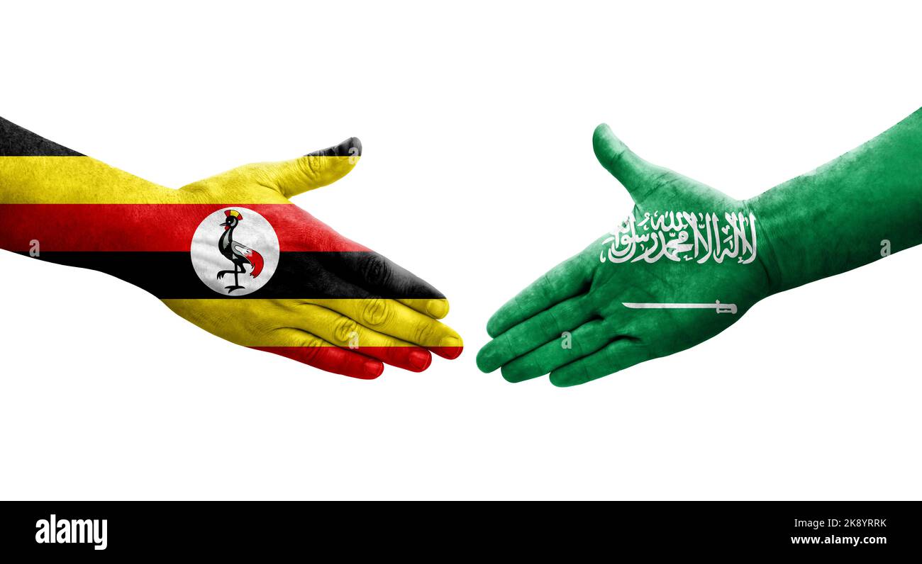 Handshake between Saudi Arabia and Uganda flags painted on hands ...