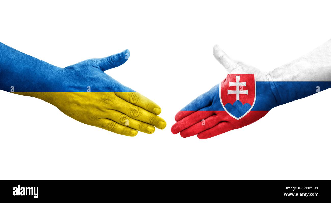 Handshake between Slovakia and Ukraine flags painted on hands, isolated ...