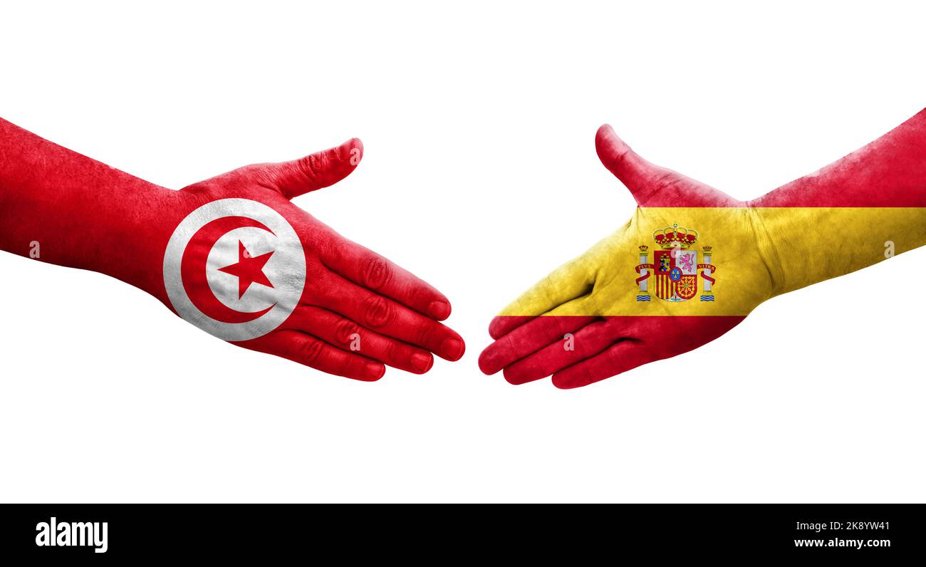 Handshake between Spain and Tunisia flags painted on hands, isolated ...