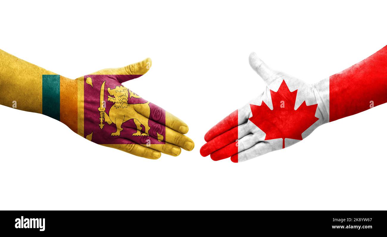 Handshake between Sri Lanka and Canada flags painted on hands, isolated ...