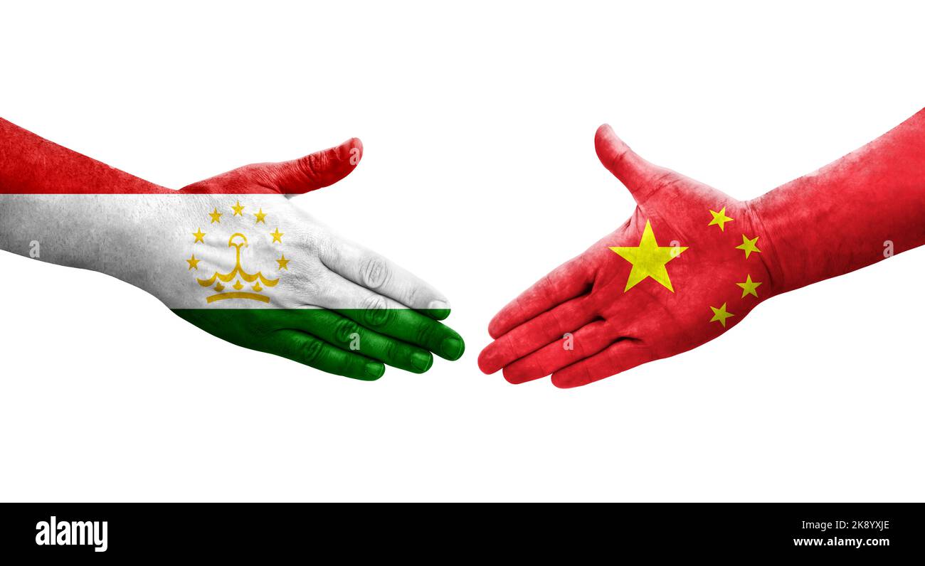 Handshake between Tajikistan and China flags painted on hands, isolated ...