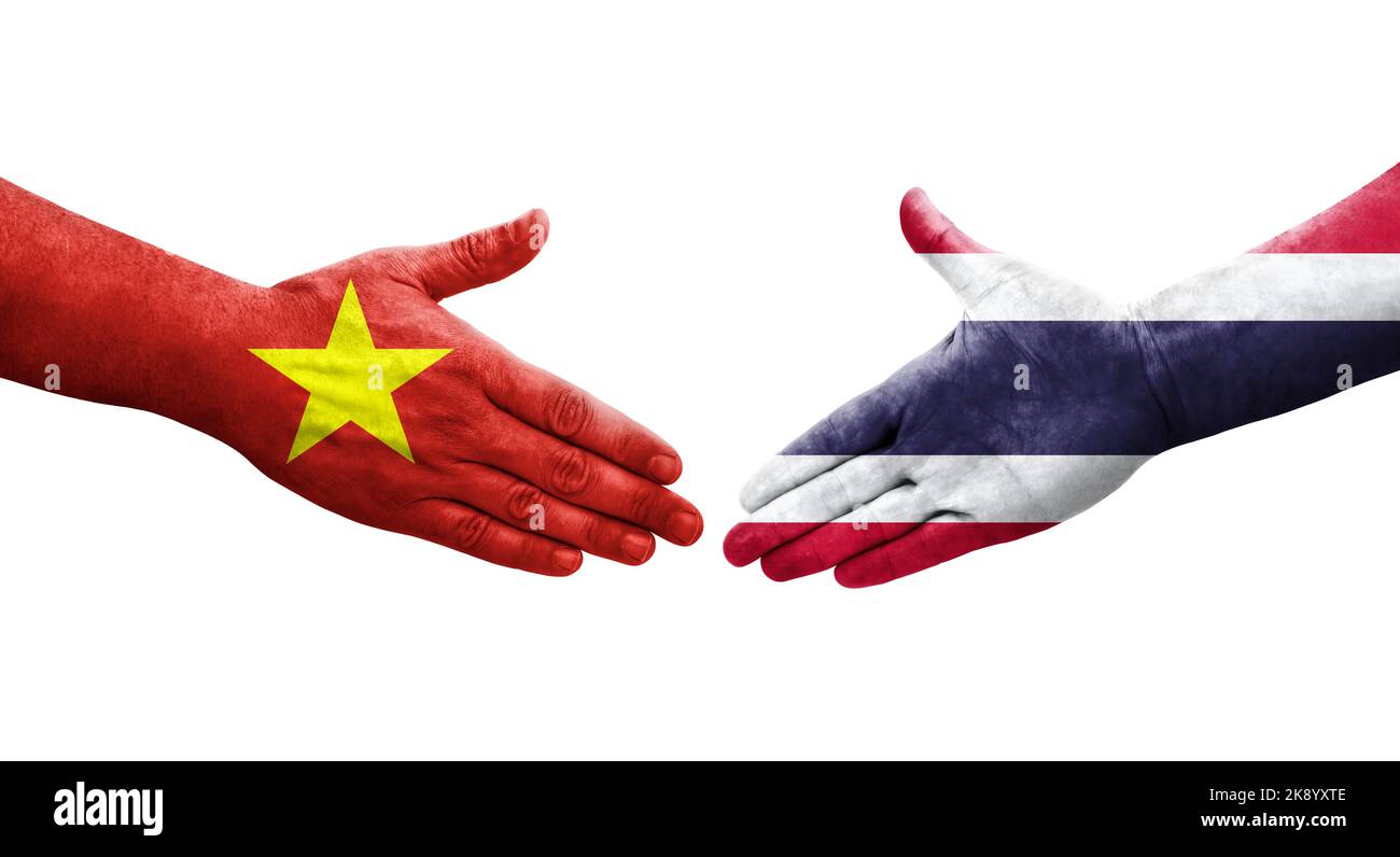 Handshake between Thailand and Vietnam flags painted on hands, isolated ...