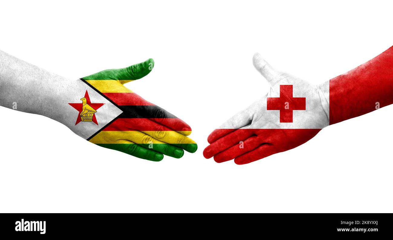 Handshake between Tonga and Zimbabwe flags painted on hands, isolated ...