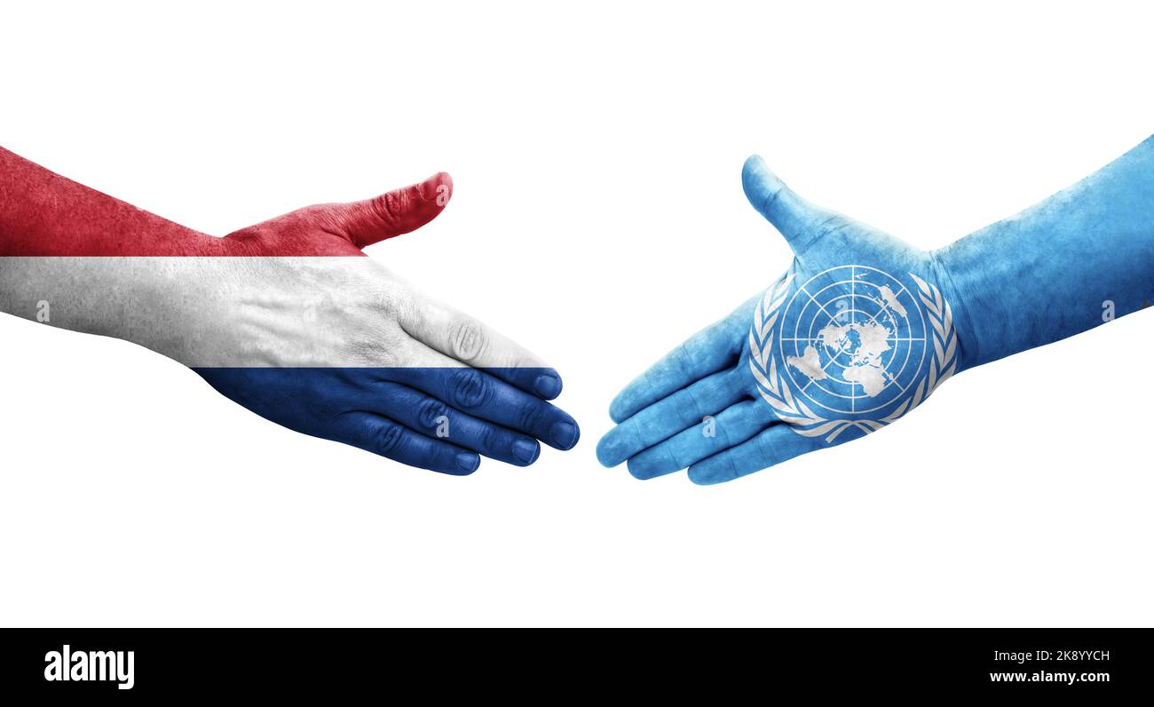 Handshake between United Nations and Netherlands flags painted on hands ...