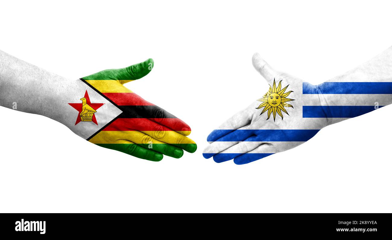 Handshake between Uruguay and Zimbabwe flags painted on hands, isolated ...