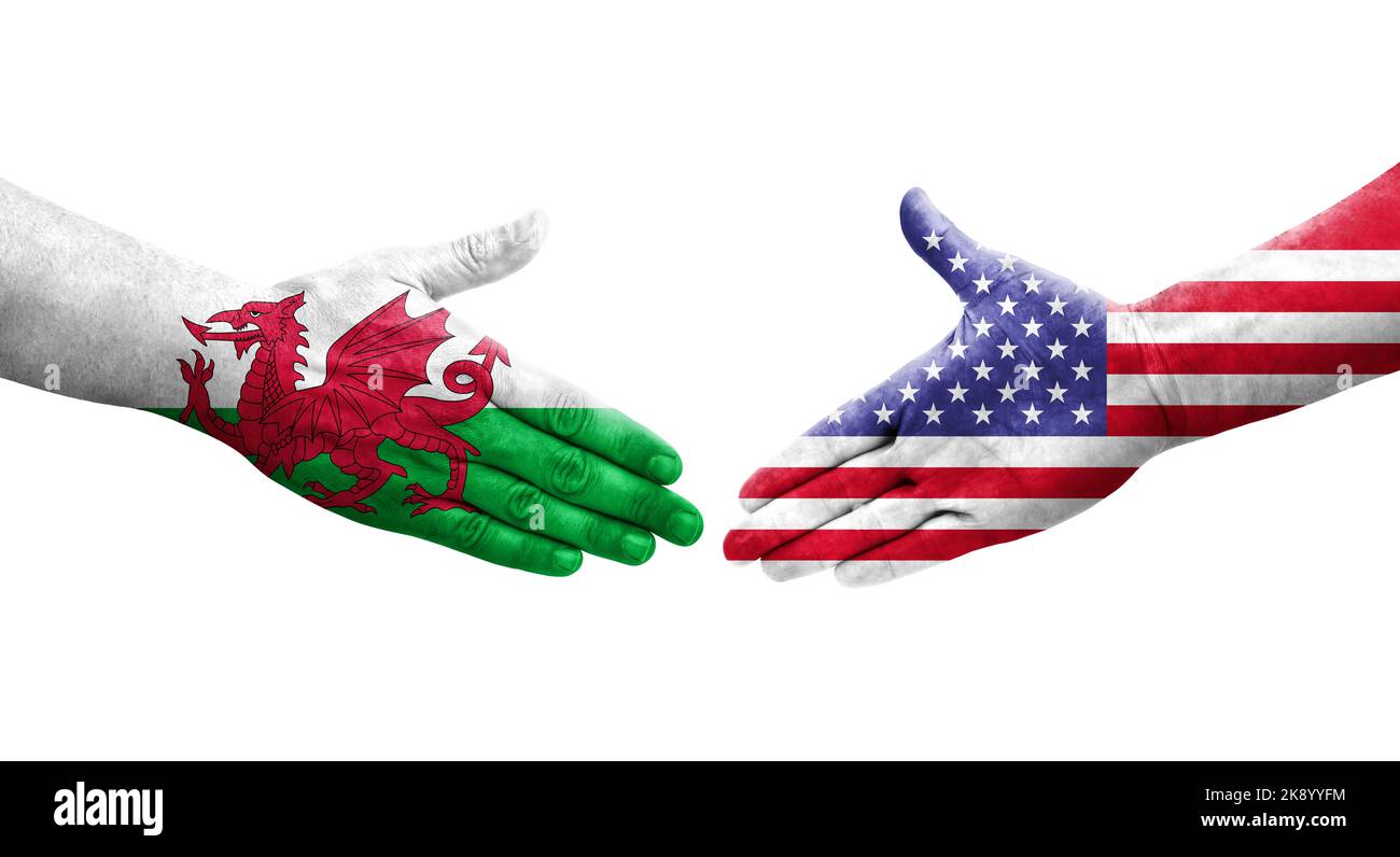 Handshake between USA and Wales flags painted on hands, isolated ...