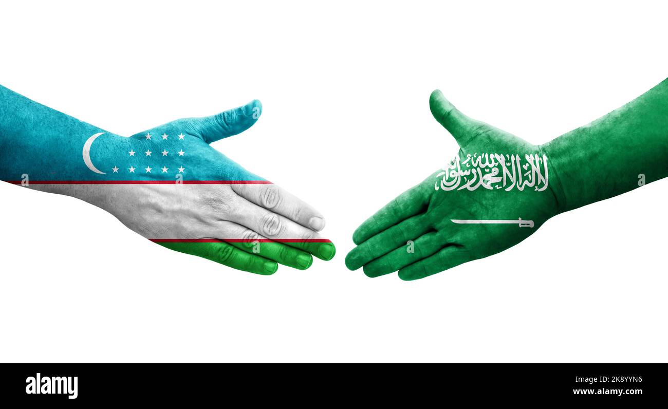 Handshake between Uzbekistan and Saudi Arabia flags painted on hands ...