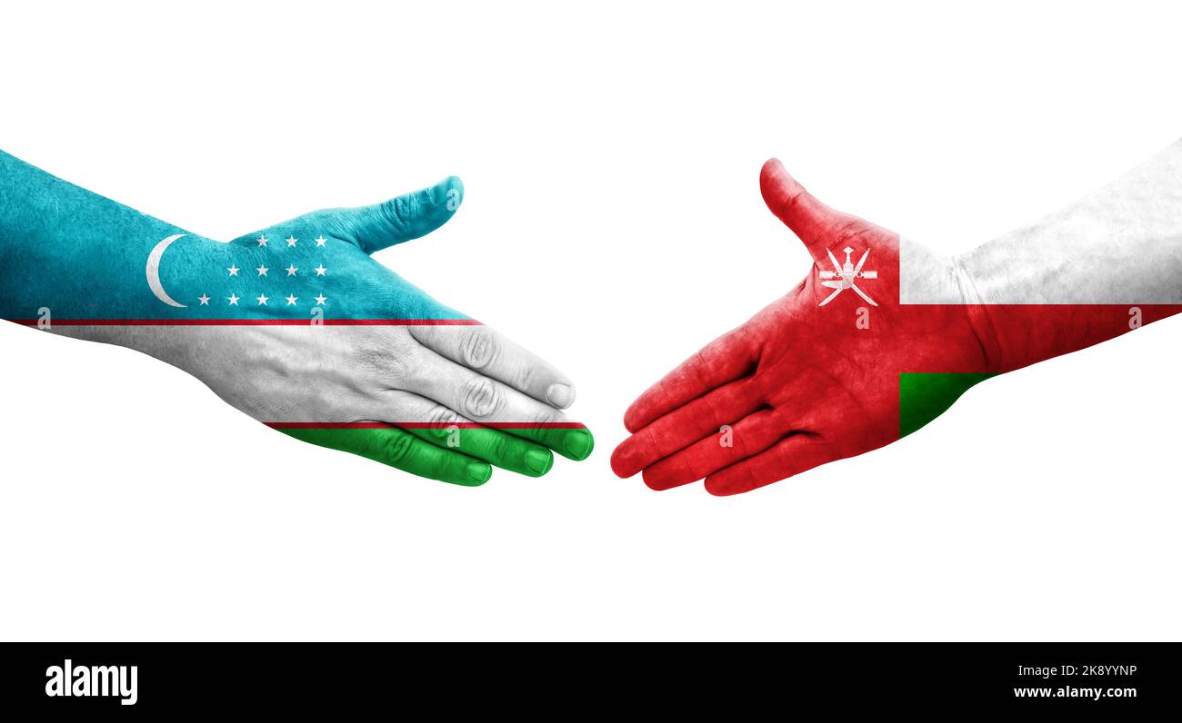 Handshake between Uzbekistan and Oman flags painted on hands, isolated ...