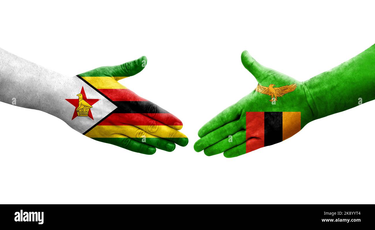Handshake between Zambia and Zimbabwe flags painted on hands, isolated ...