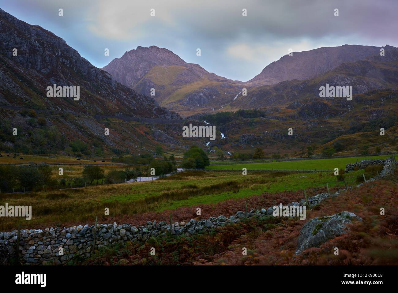 A rural area surrounded with rocky mountains in Maes Caradoc, North ...