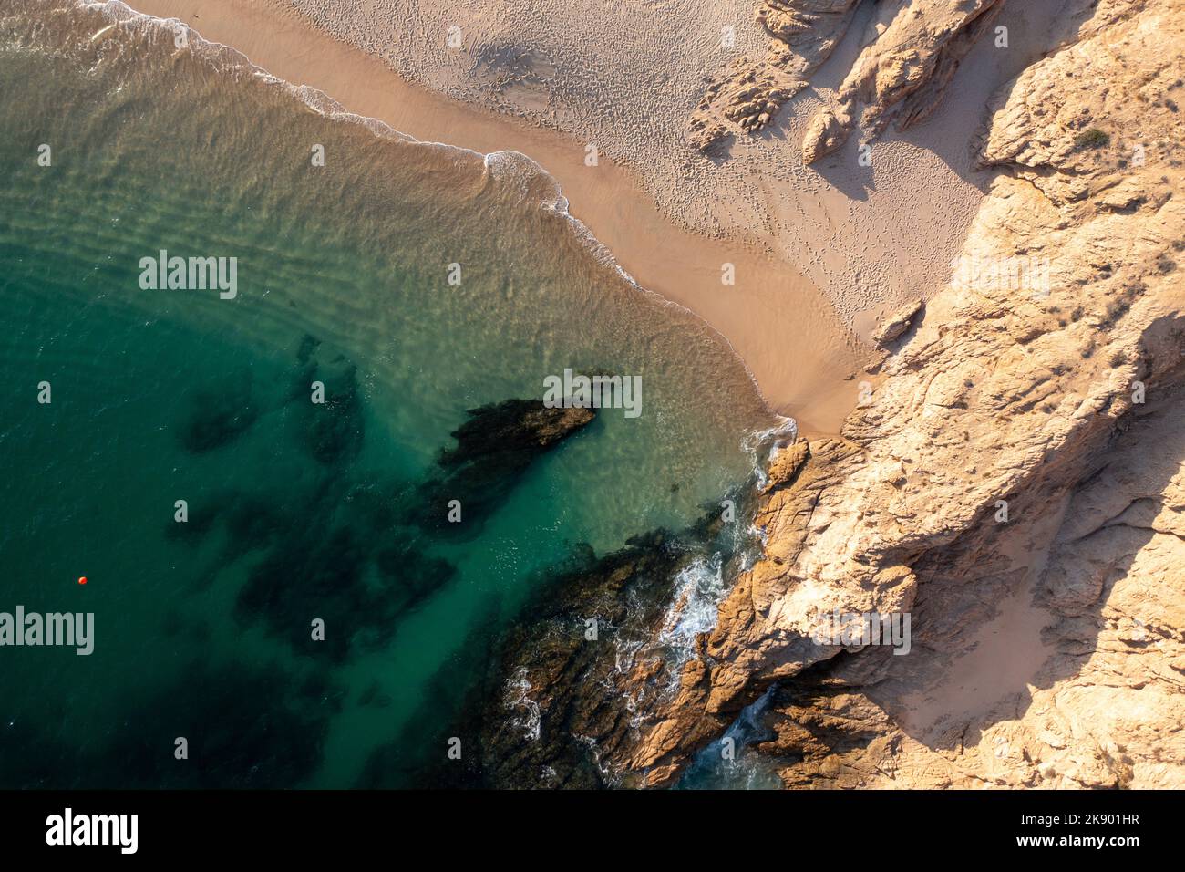 An aerial view of the Lovers Beach sea stacks meeting sea waves Stock ...