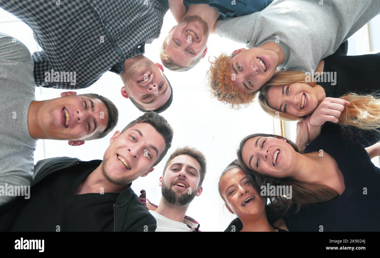 bottom view. group of diverse young people standing in a circle Stock ...