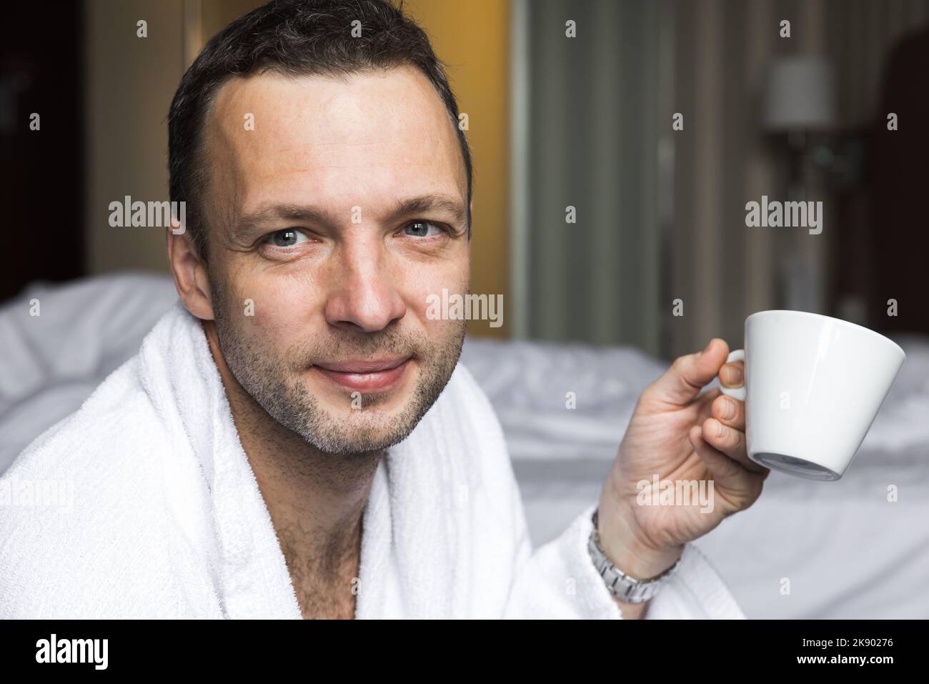 Man in white hotel robe hi-res stock photography and images - Alamy