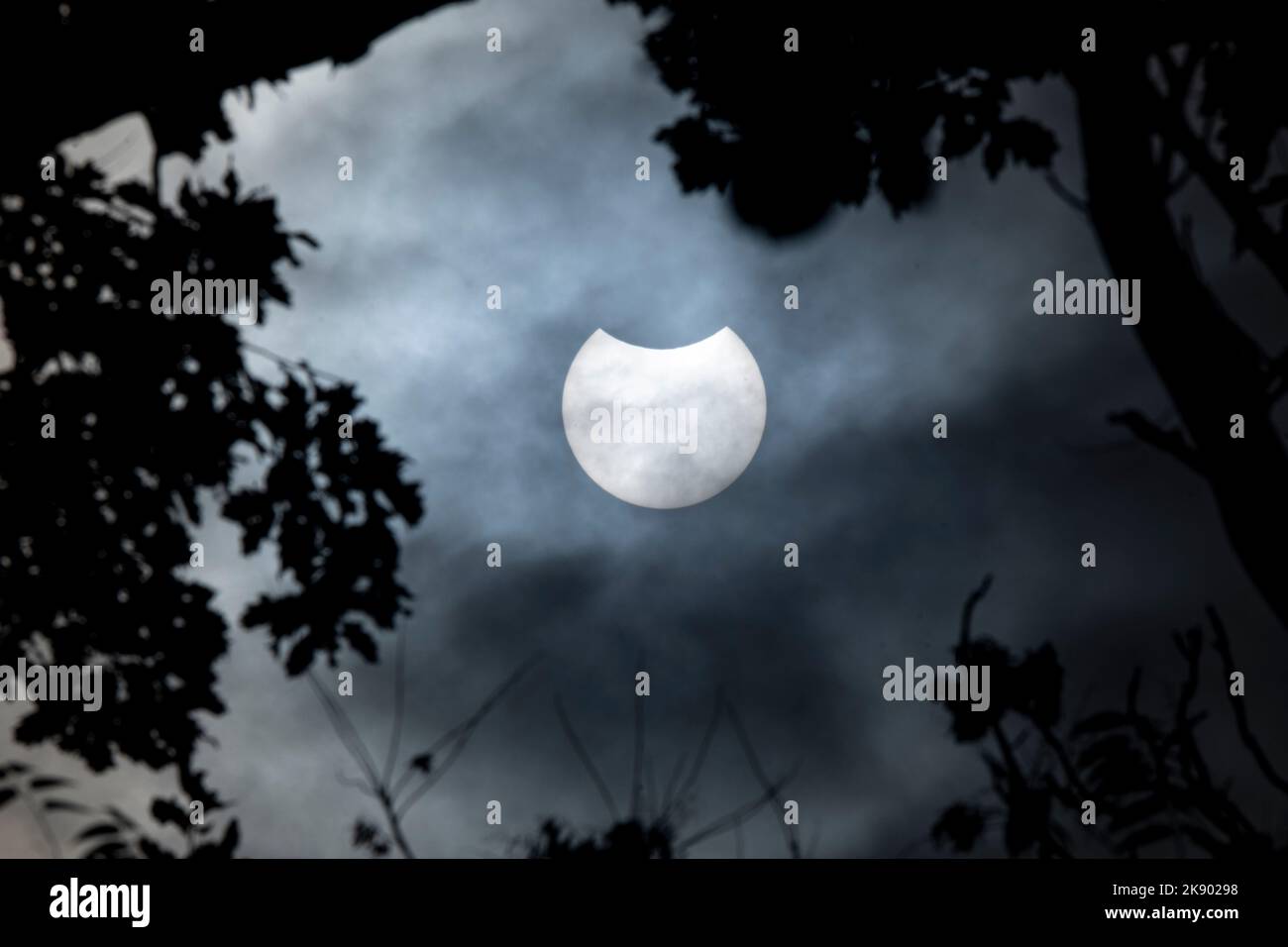 Berlin, Germany. 25th Oct, 2022. The sun is partially covered by the moon during a partial solar ...