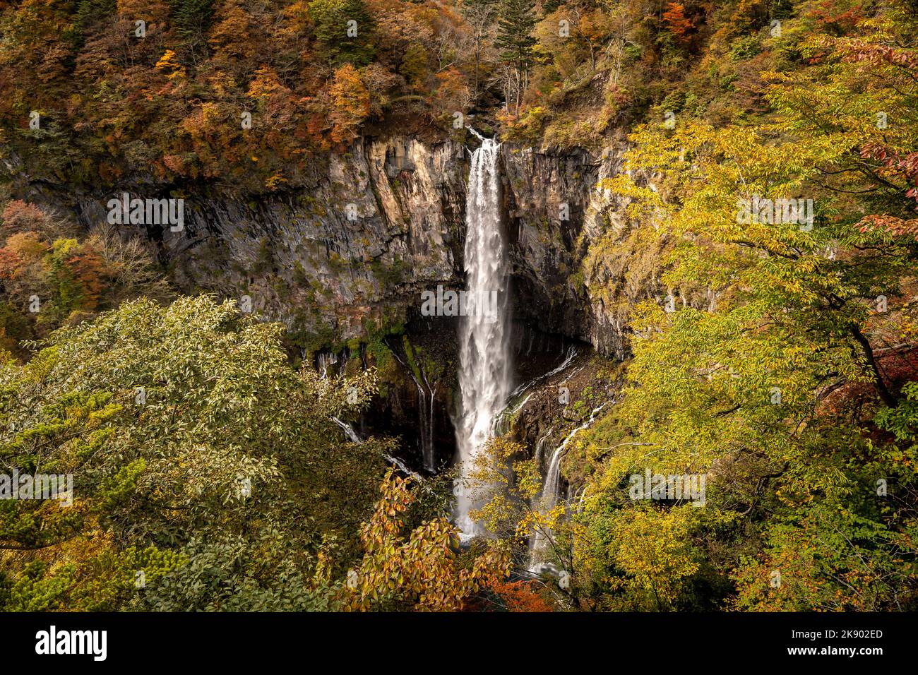 Colorful majestic waterfall in national park forest during autumn ...