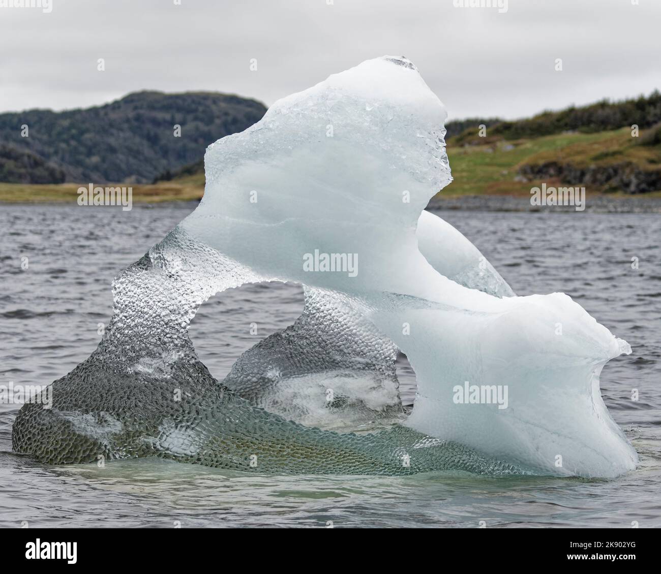 Close-up of the remains of an iceberg showing sections that contain ...