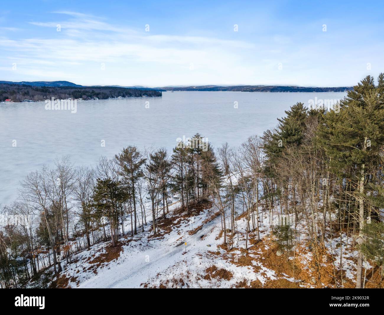An arial shot of the trees in the forest covered with snow and the ...