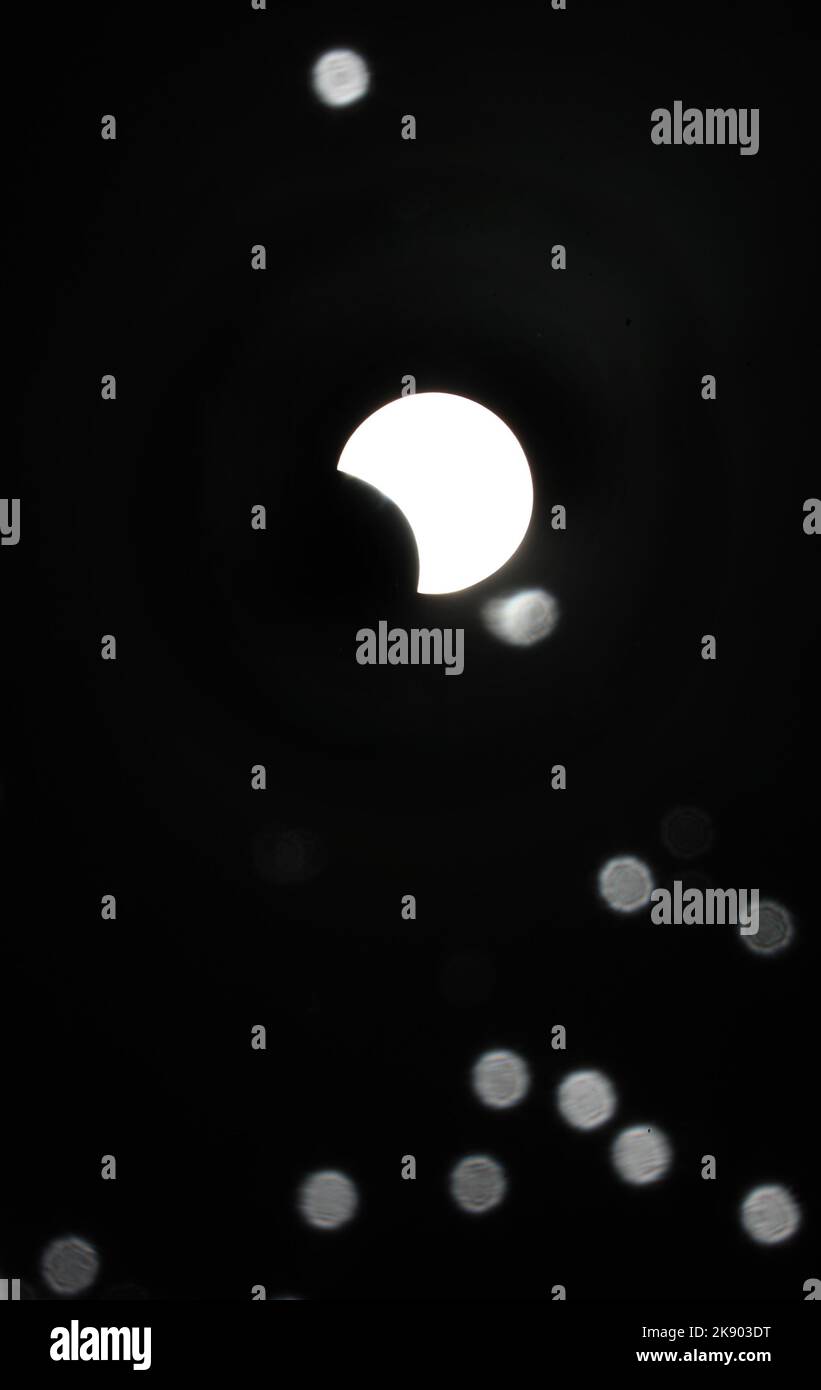 Aitrang, Germany. 25th Oct, 2022. The sun, partially obscured by the ...