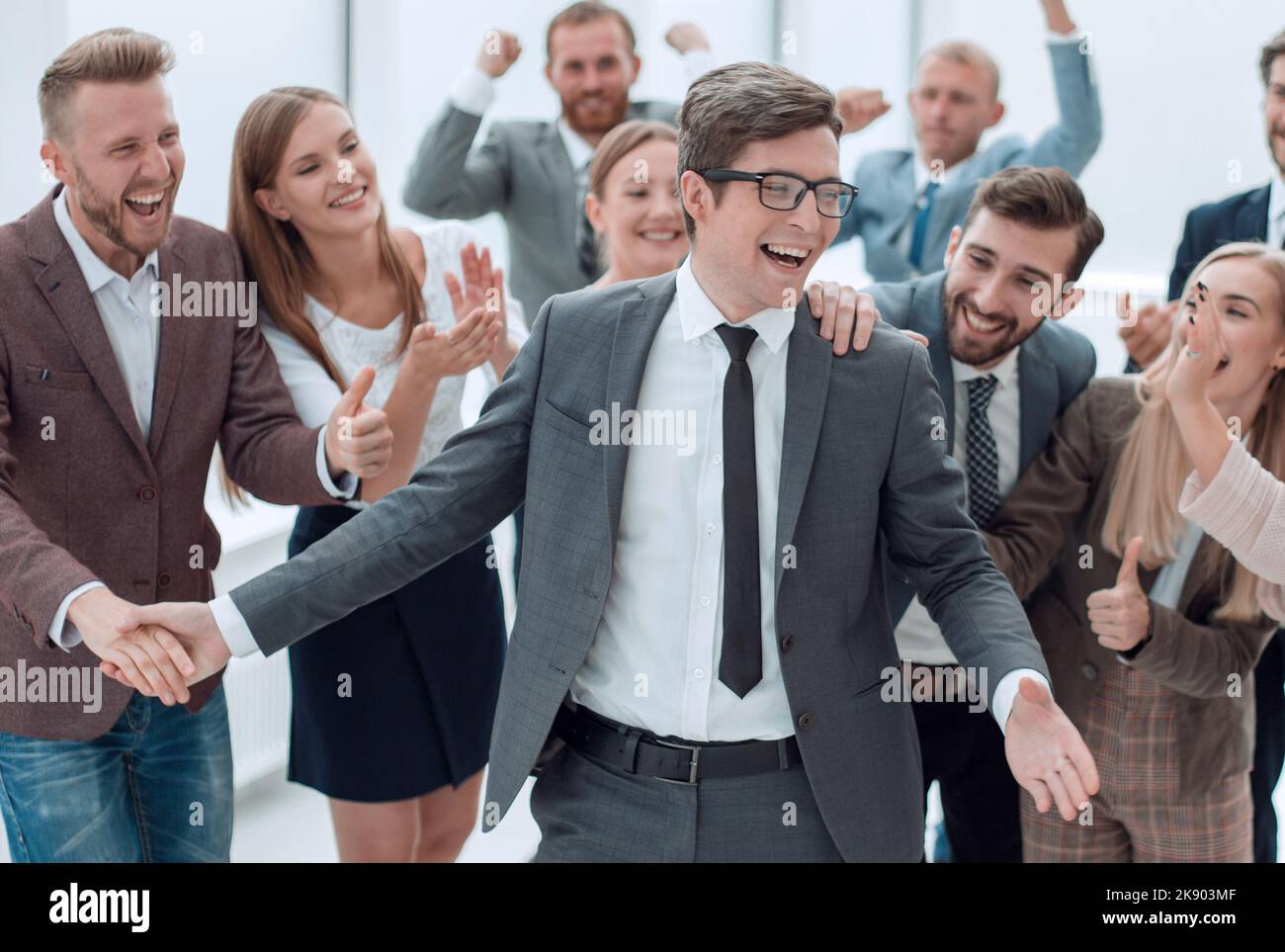 boss and the gleeful business team standing together Stock Photo - Alamy