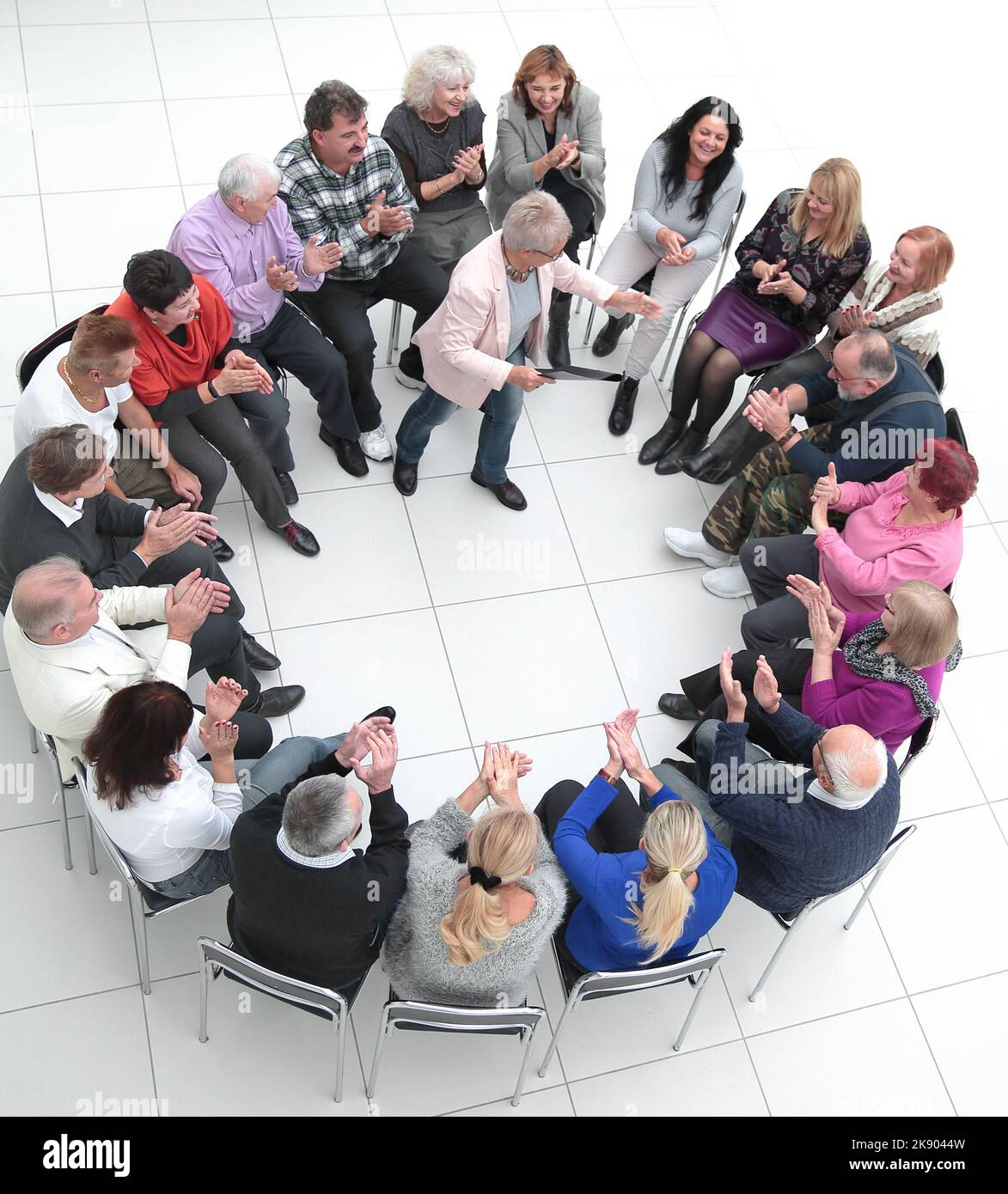 confident older woman standing in a circle of like-minded people Stock ...