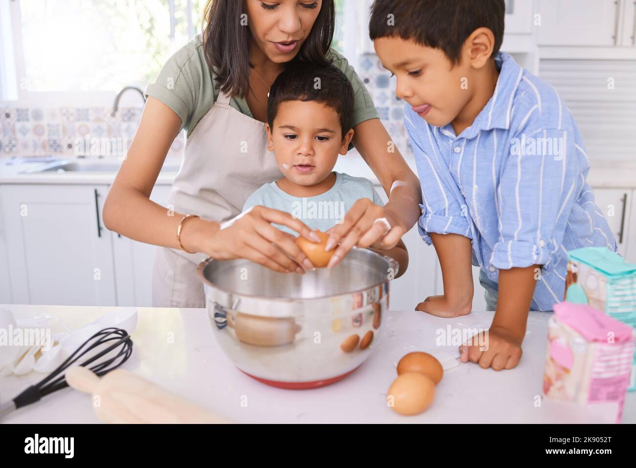 Cooking, learning and mother with children in kitchen for happy ...
