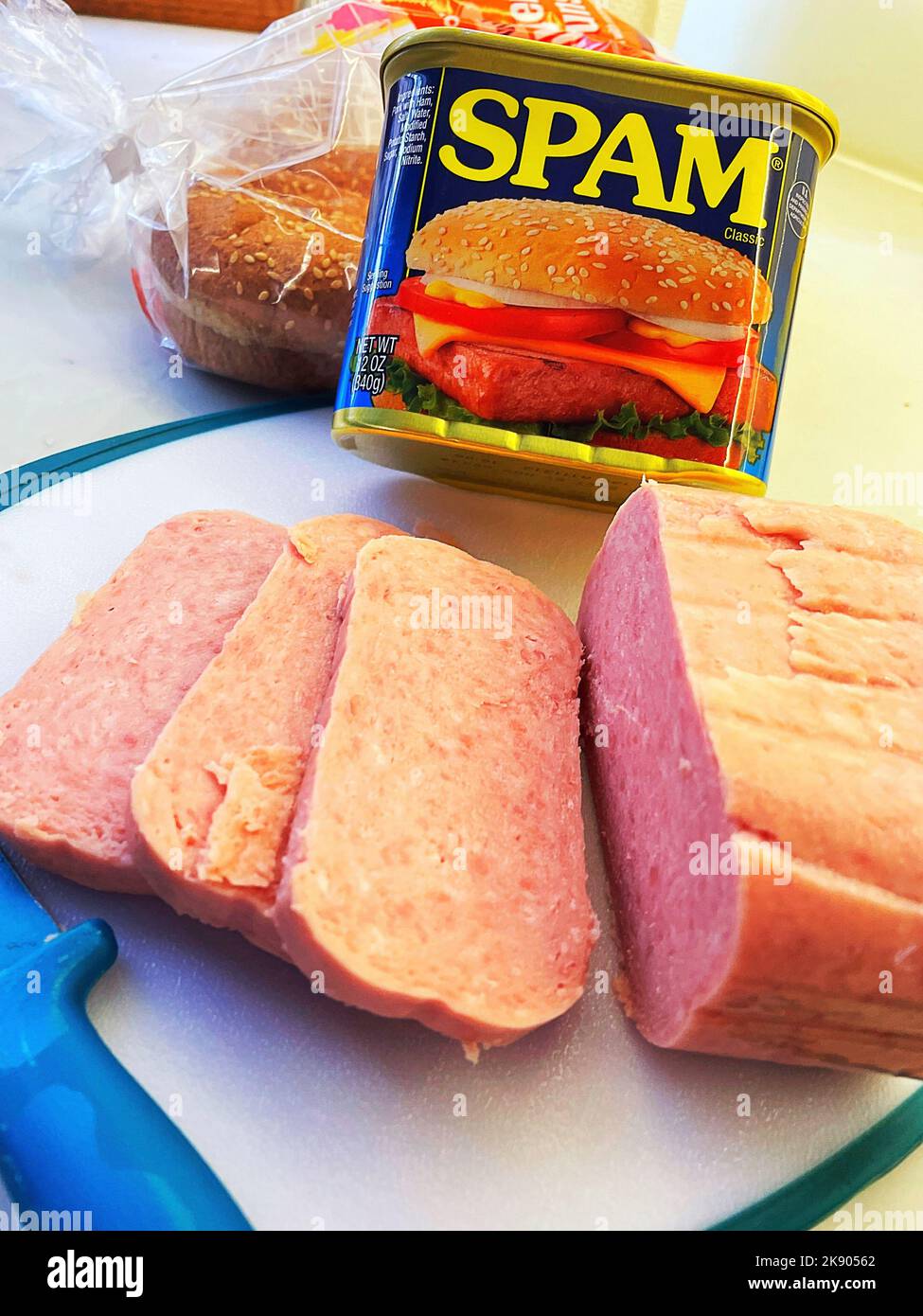 Still life of a tin of spam next to a sliced loaf on a residential ...