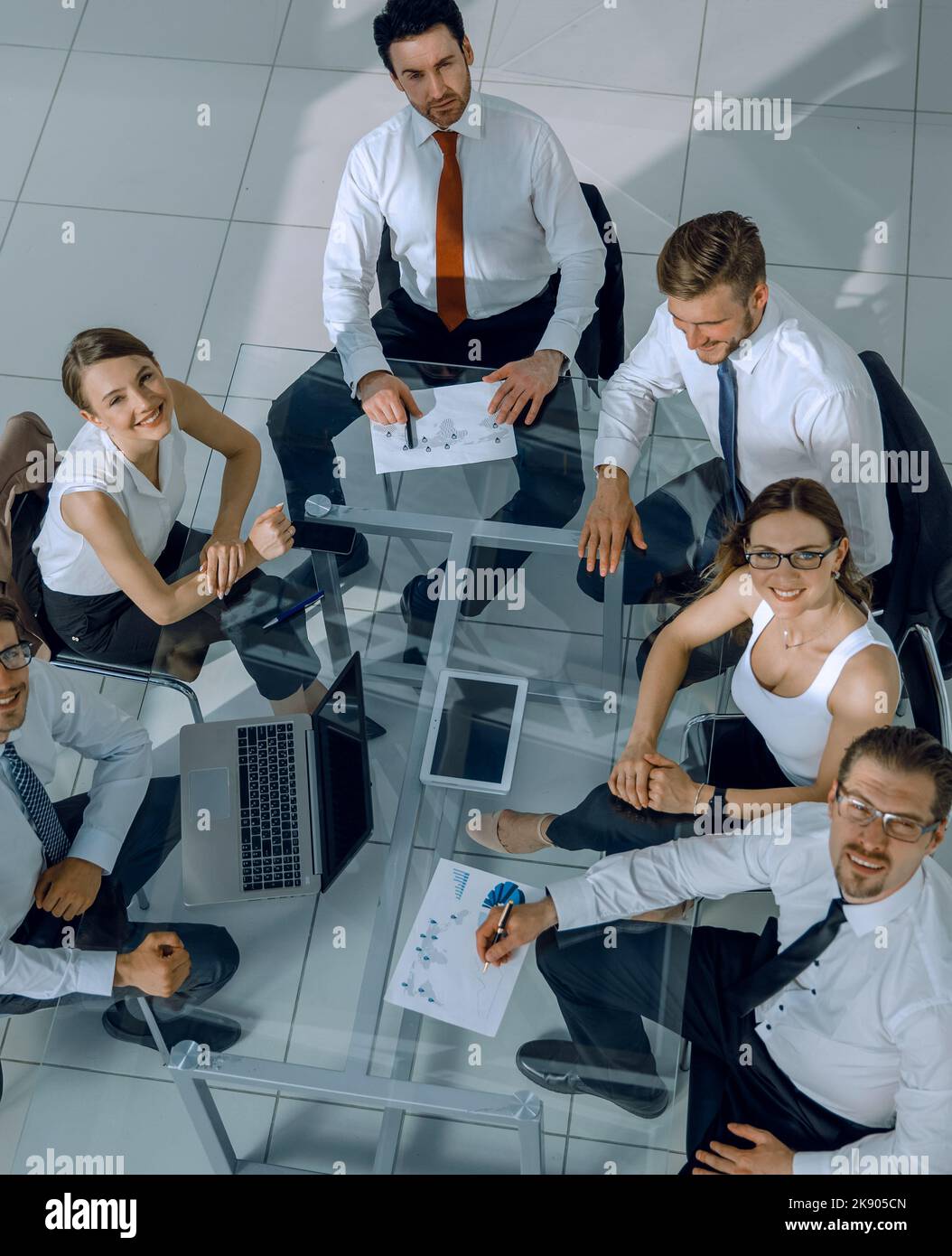 Business People Working Around a Conference Table Stock Photo - Alamy