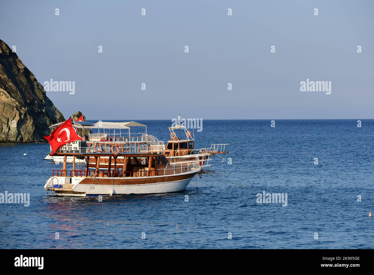 Tourist cruise boat at anchor near Cirali beach in Turkey Stock Photo ...