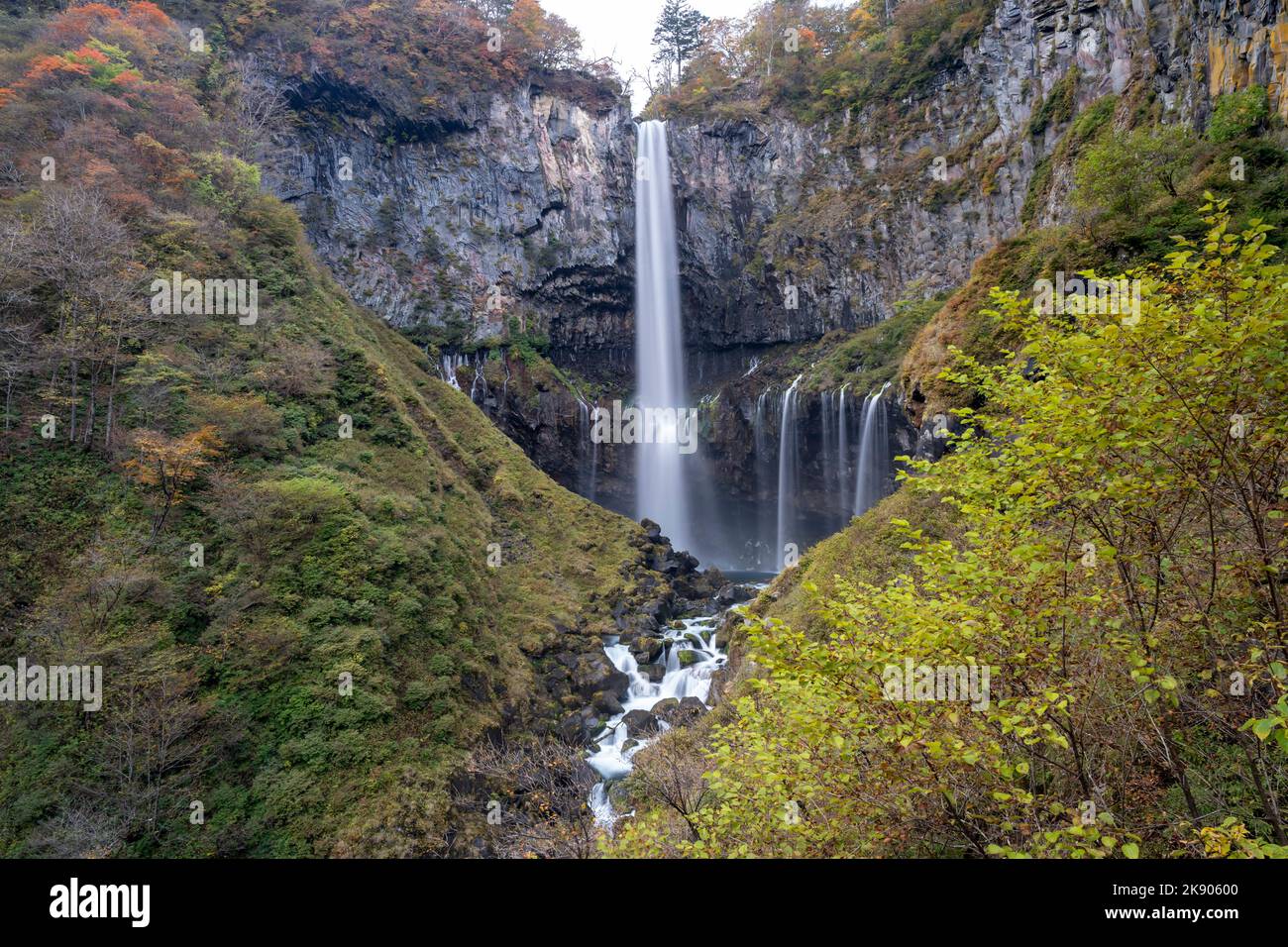 Colorful majestic waterfall in national park forest during autumn ...