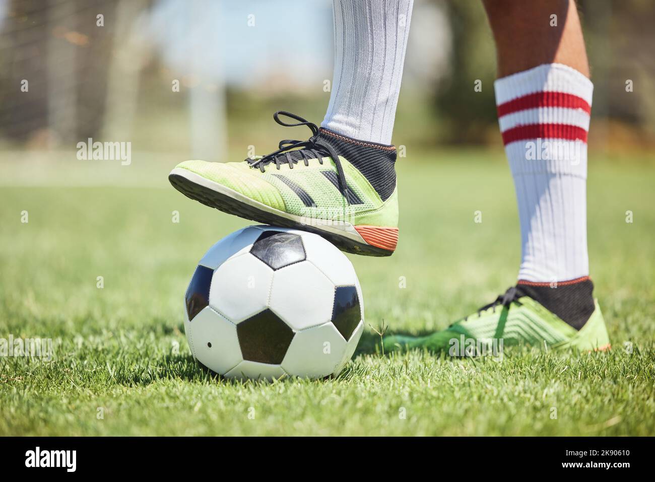 Soccer ball, soccer player shoes and foot on field to kick off ...