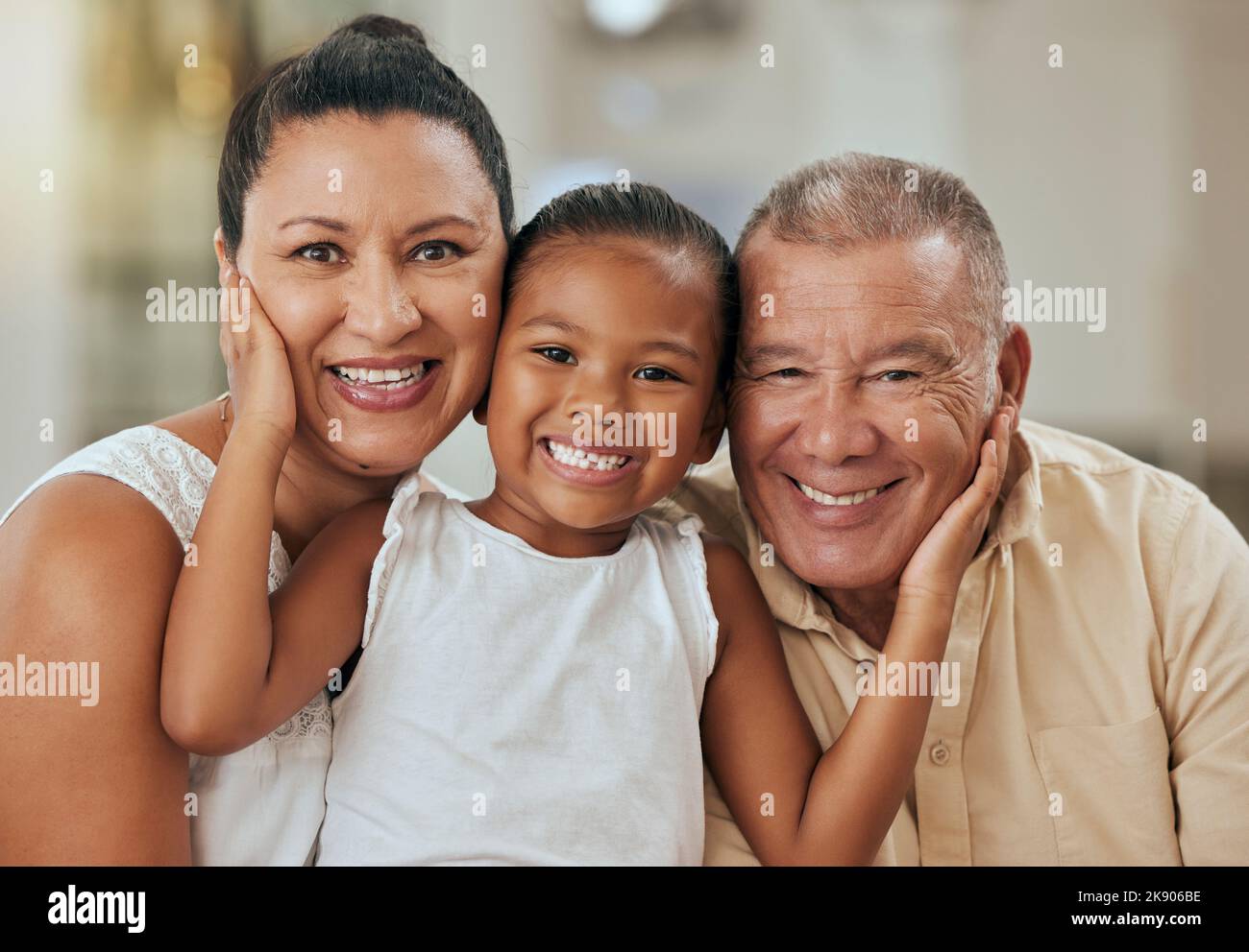 Family, portrait and face of girl with grandparents in living room ...