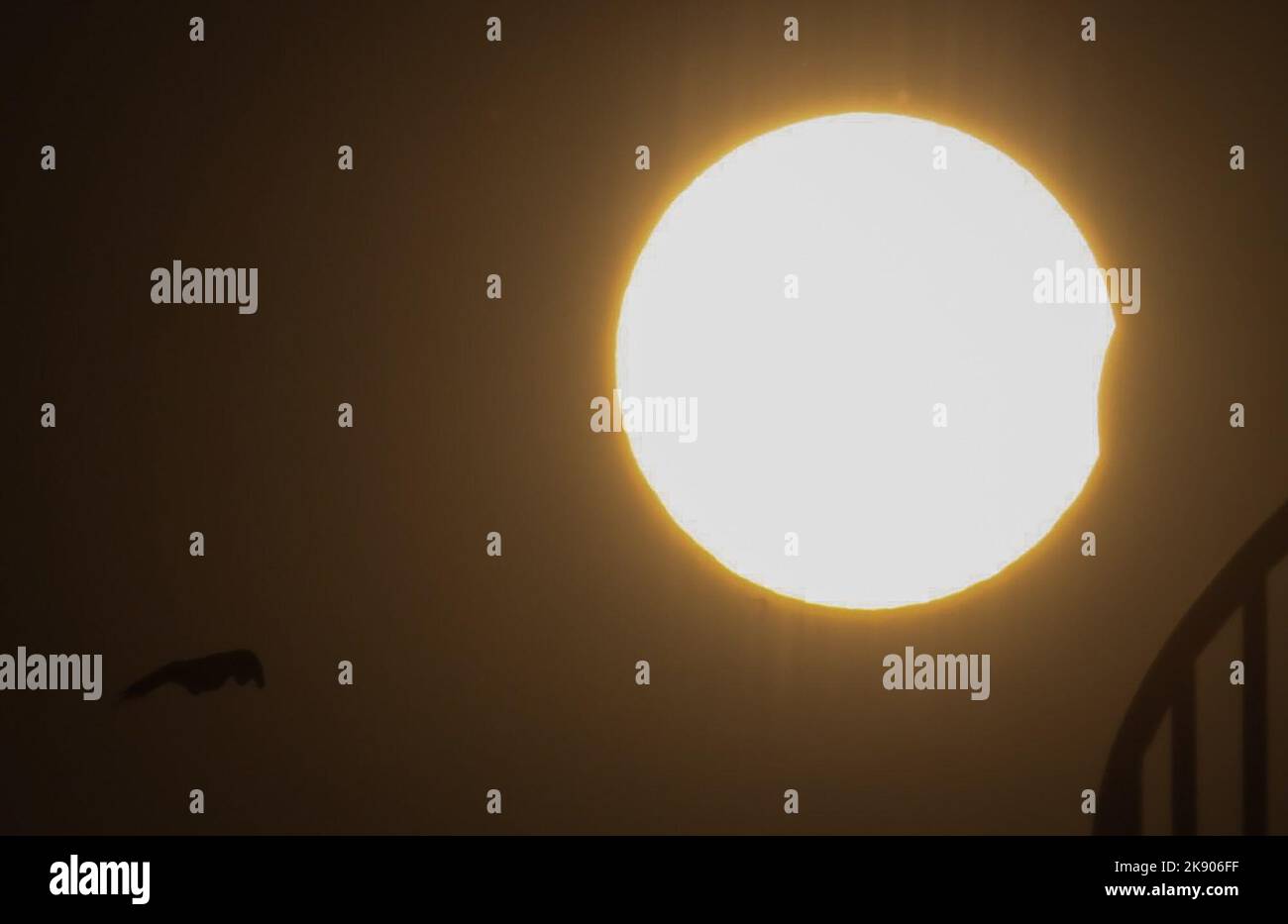 October 25, 2022, Kathmandu, Bagmati, Nepal: A partial solar eclipse is ...