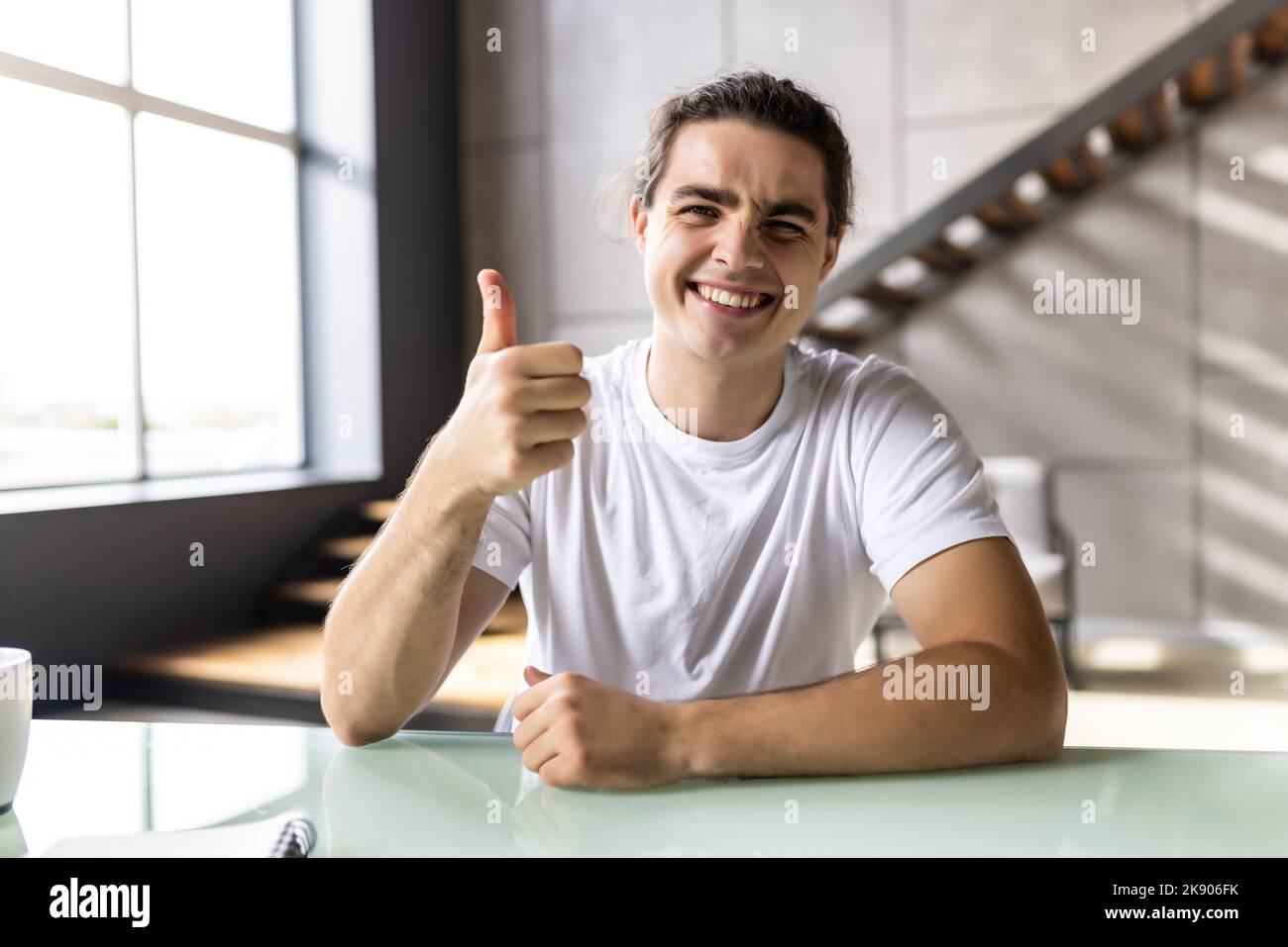 Caucasian male having a video work call with colleagues. Remote work ...