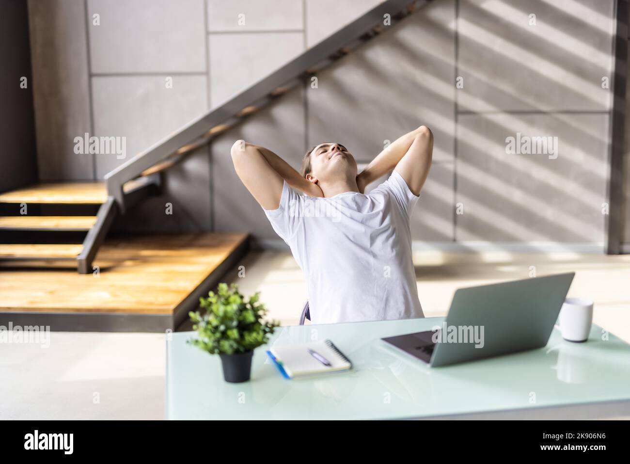 Meeting friday. Happy young guy freelancer enjoy calm moment when task ...