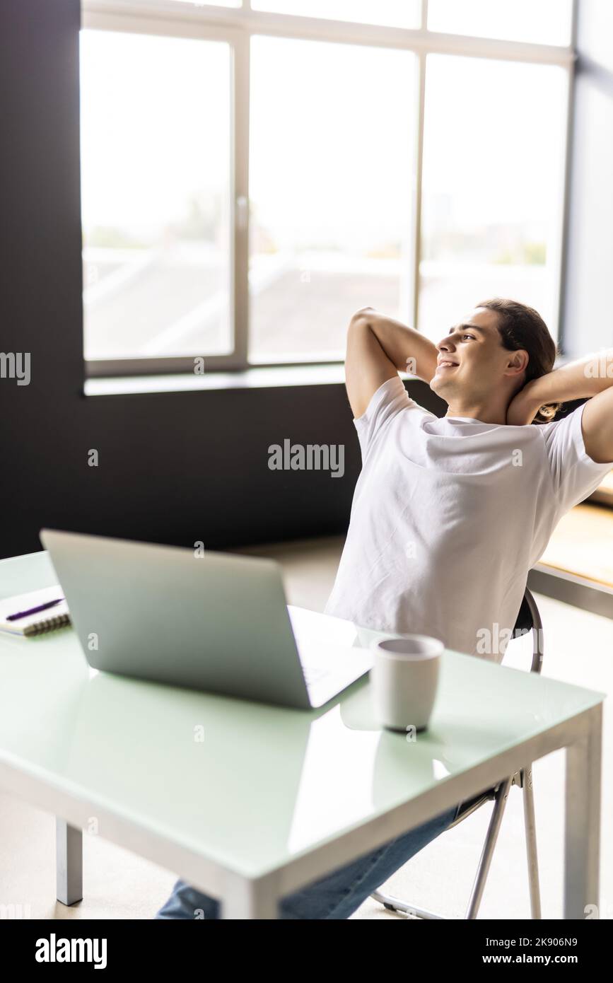 Meeting friday. Happy young guy freelancer enjoy calm moment when task ... Meeting friday. Happy young guy freelancer enjoy calm moment when task ...