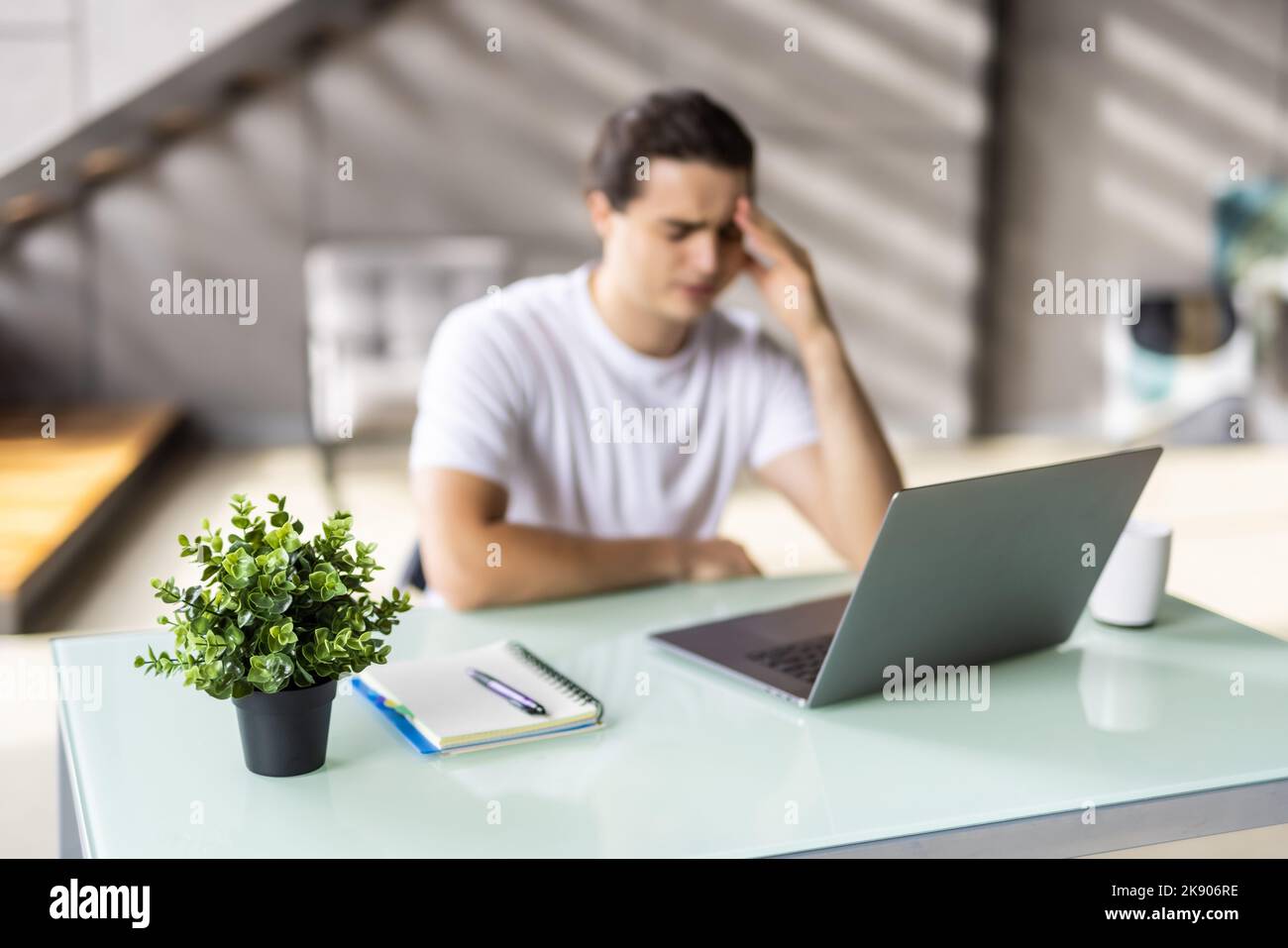 Tired young man feel pain eyestrain holding rubbing dry irritated eyes ...