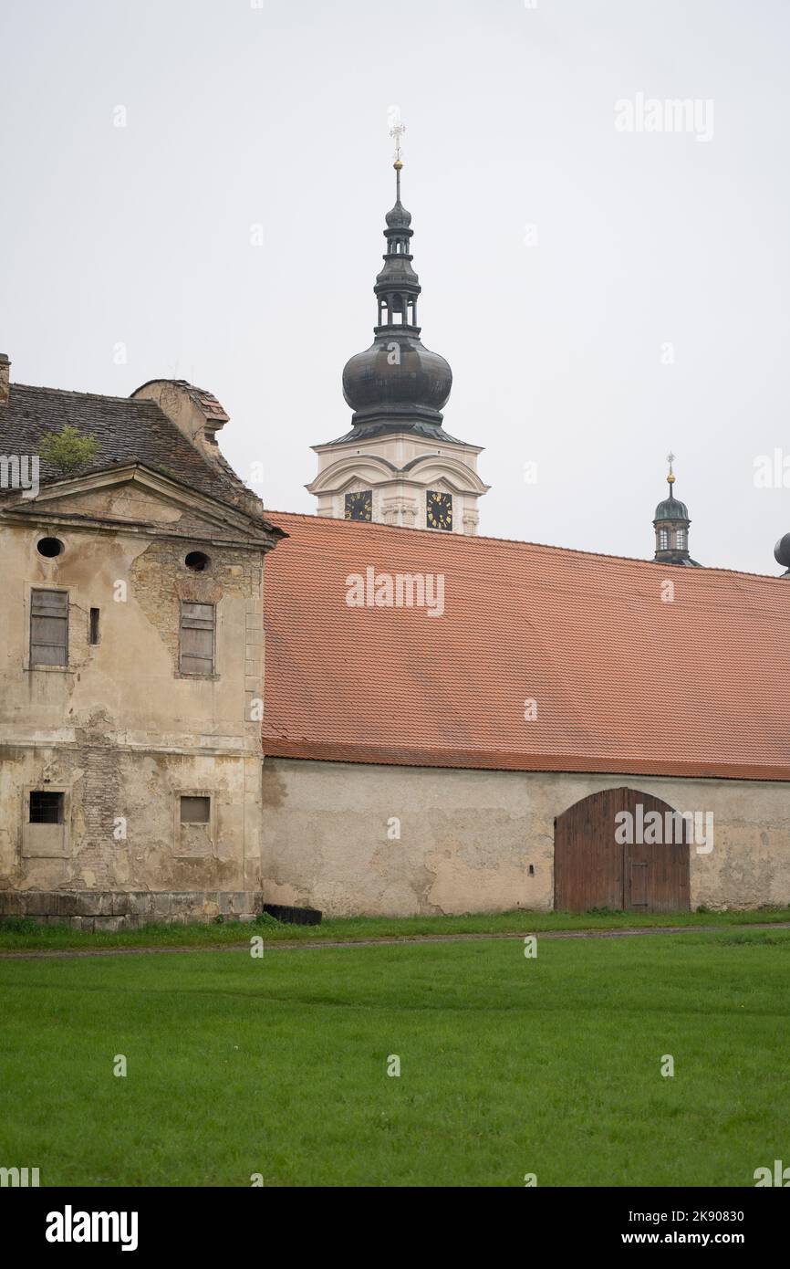 An old, medieval church with green pasture in the yard, vertical Stock ...