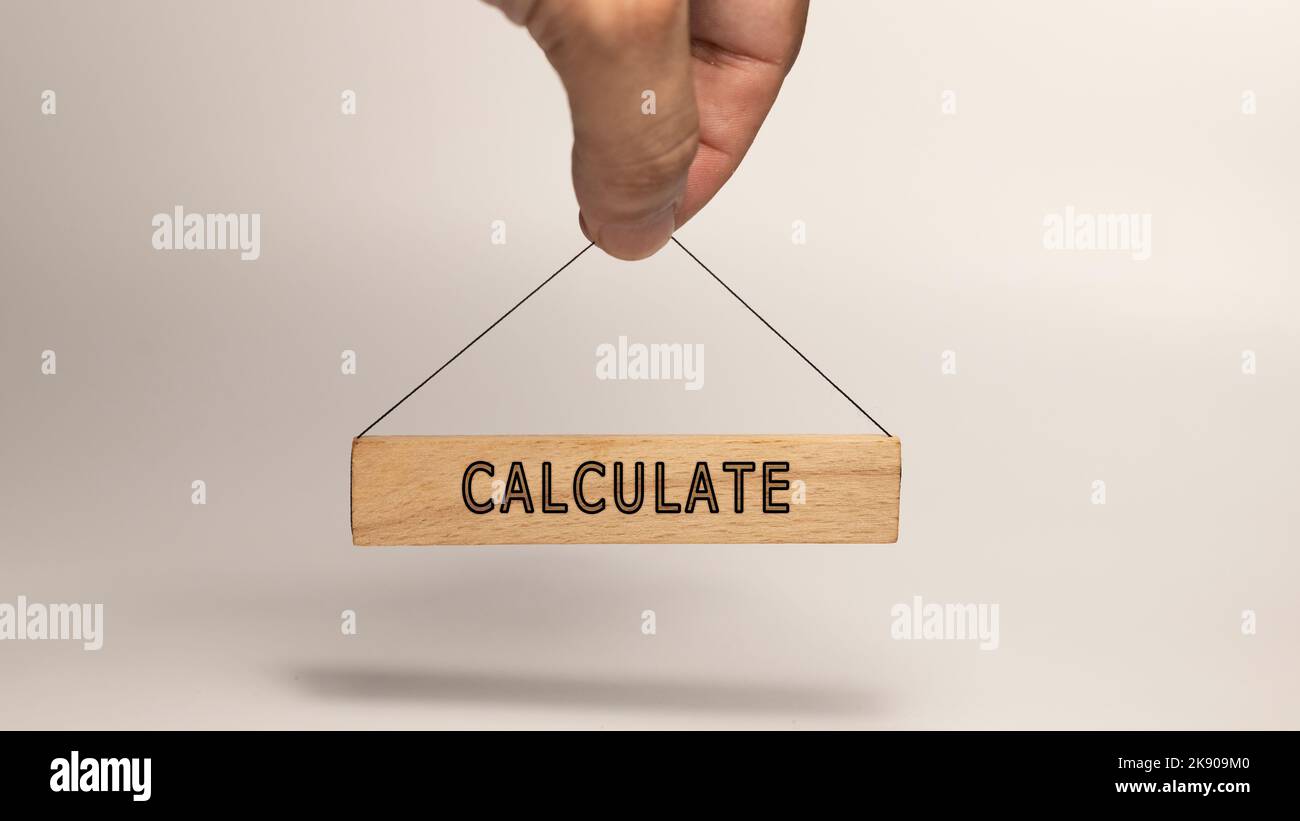 The calculate word. Wooden cubes with text calculate Stock Photo - Alamy