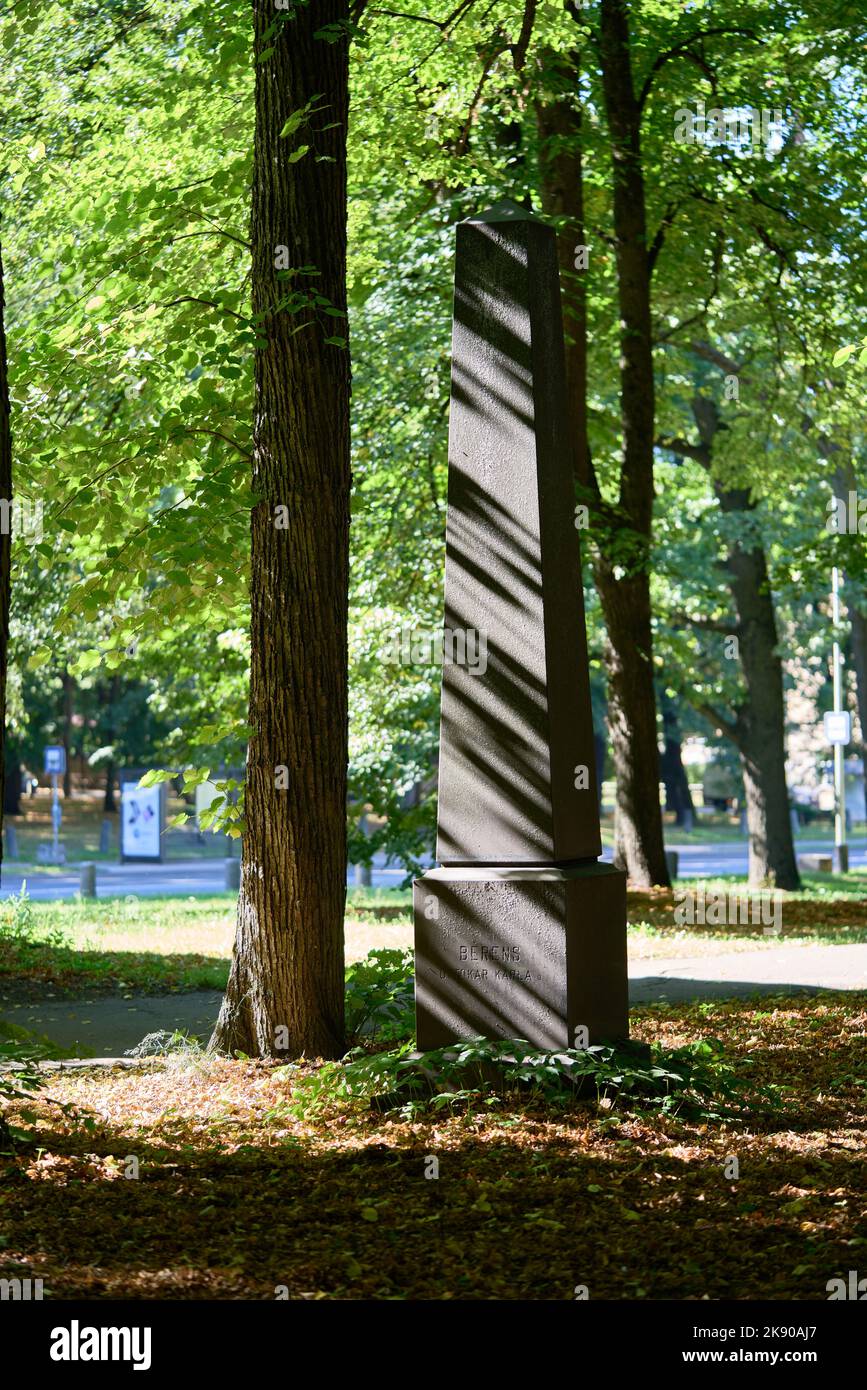 A vertical shot of a black granite gravestone tower at the Great ...