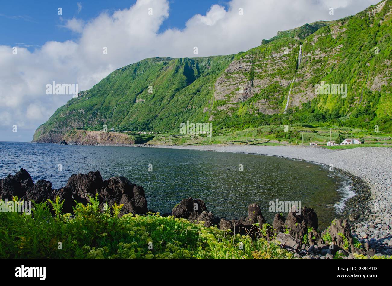 A beautiful scenery of Poco do Bacalhau Waterfall and river with rocky ...