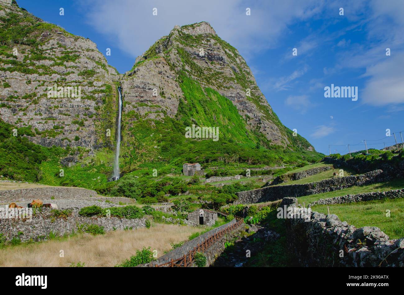 A beautiful scenery of Poco do Bacalhau Waterfall with rocky mountain ...