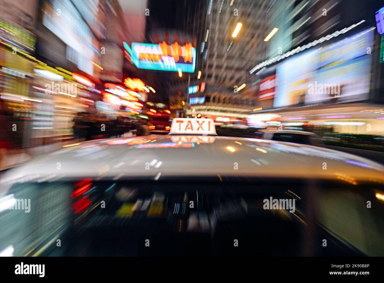 Taxi at speed in Hong Kong with the sign Stock Photo - Alamy